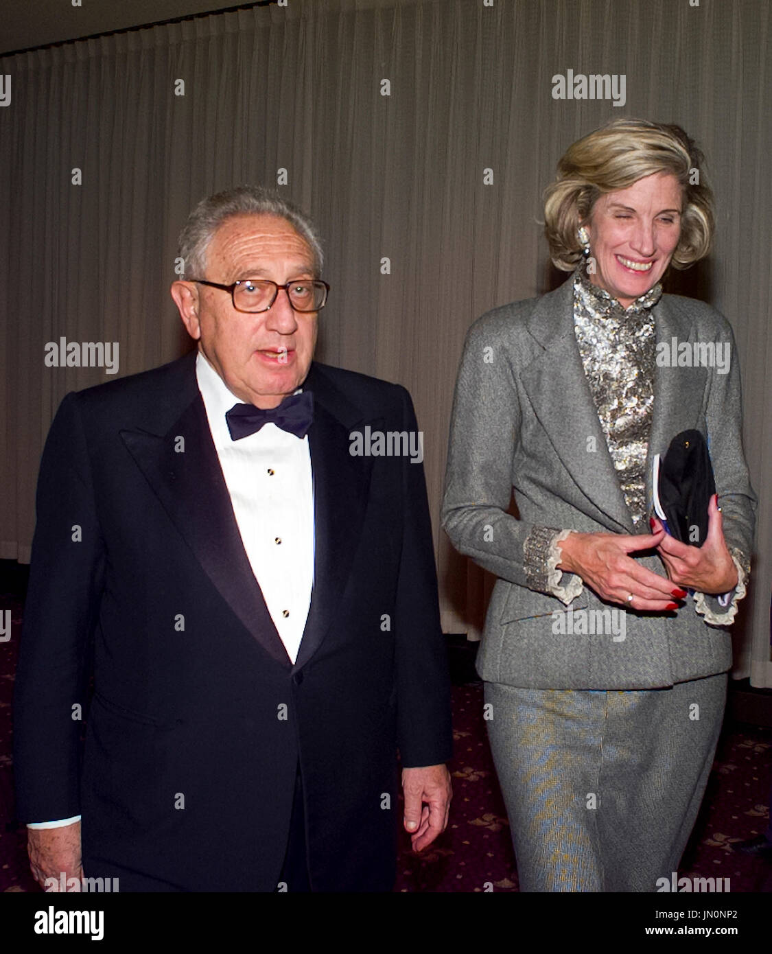 Former United States Secretary of State Henry Kissinger and his wife ...