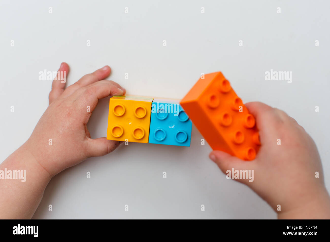 kids hands playing with lego bricks Stock Photo - Alamy