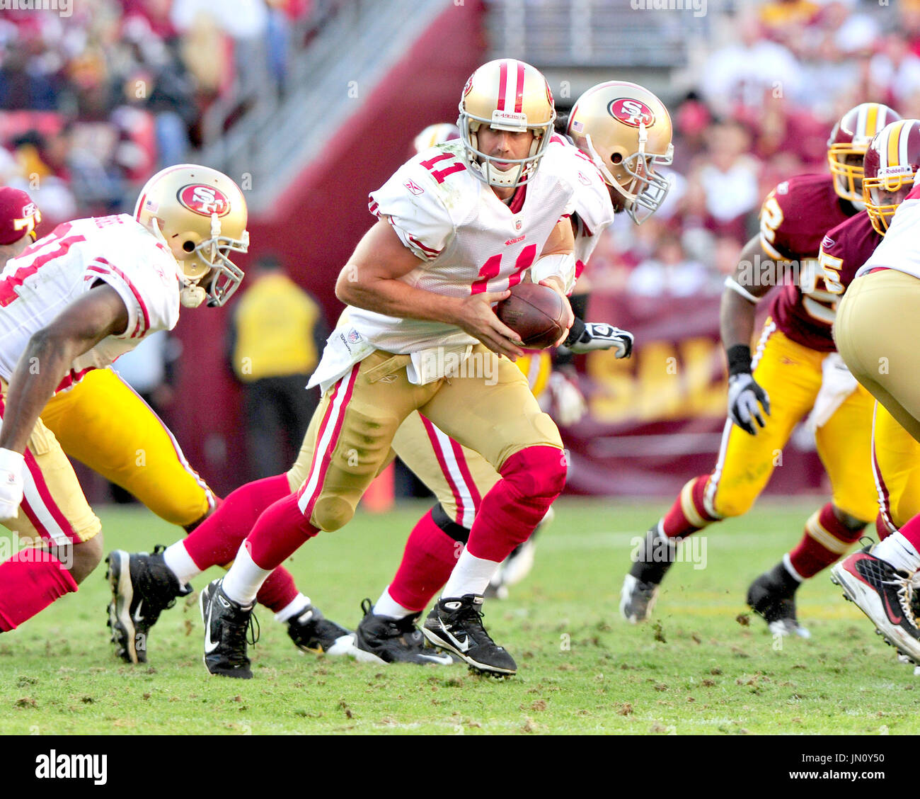 San Francisco 49ers quarterback Alex Smith (11) prepares to hand-off to ...