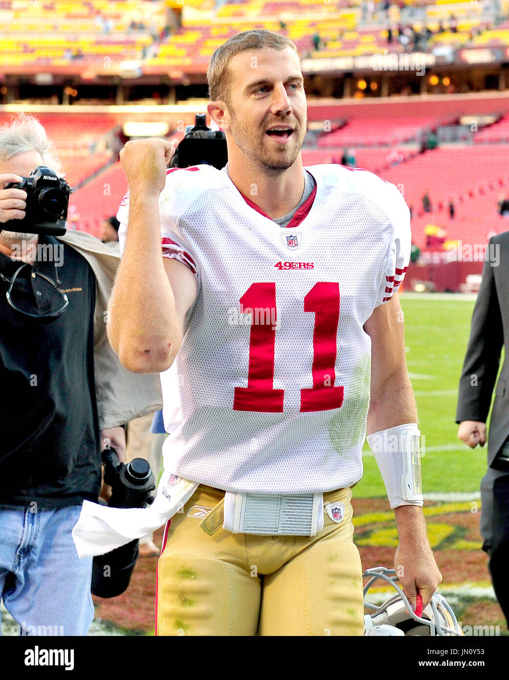 San Francisco 49ers quarterback Alex Smith (11) celebrates as he leaves ...