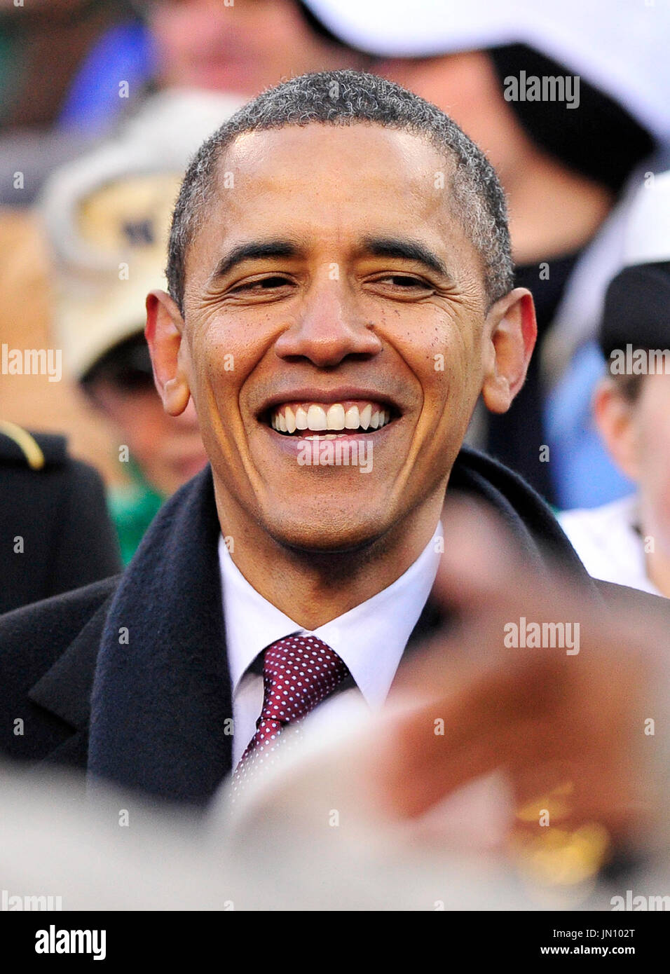 United States President Barack Obama smiles as he watches the 112th ...