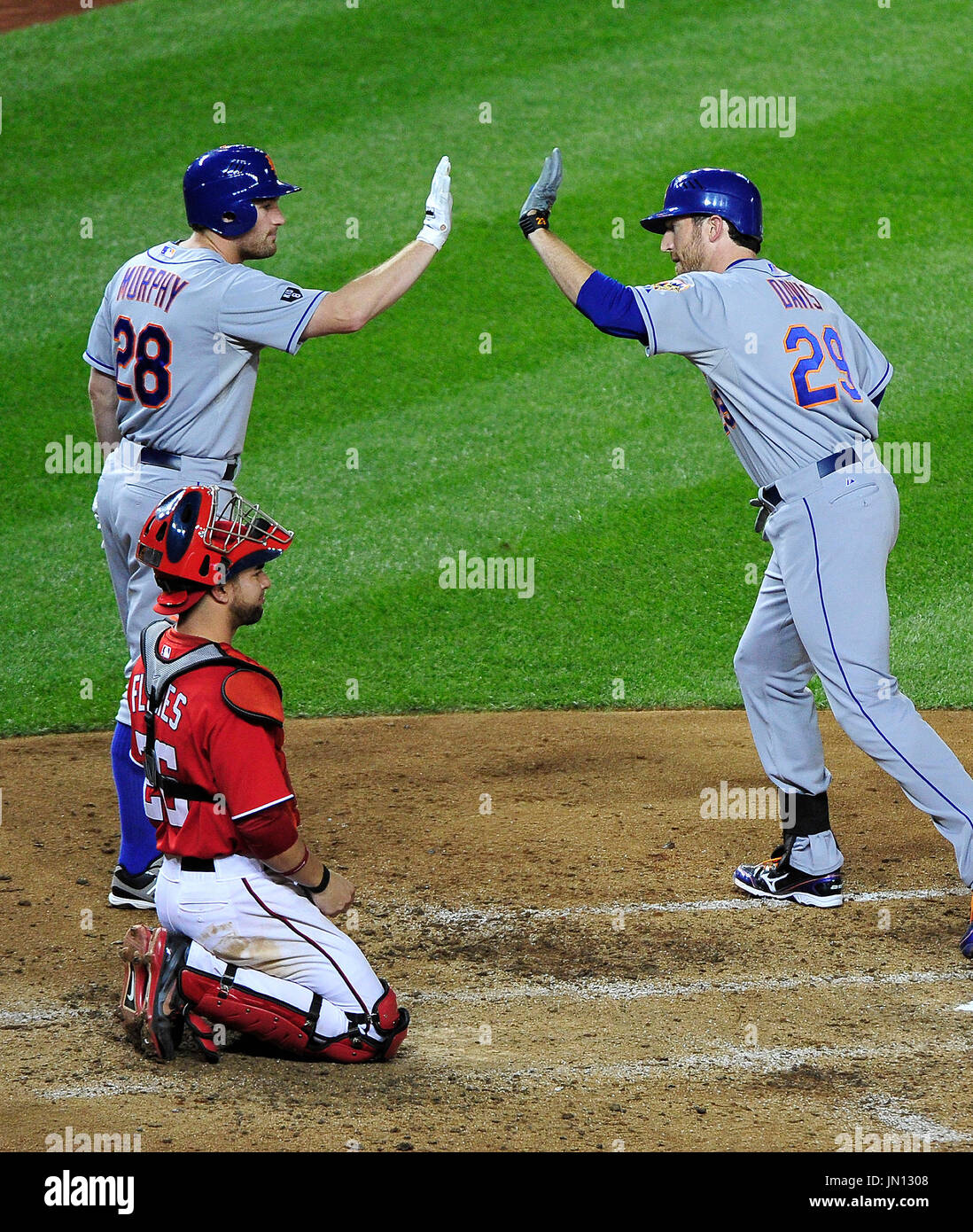 New York Mets first baseman Ike Davis (29), right, celebrates his ...