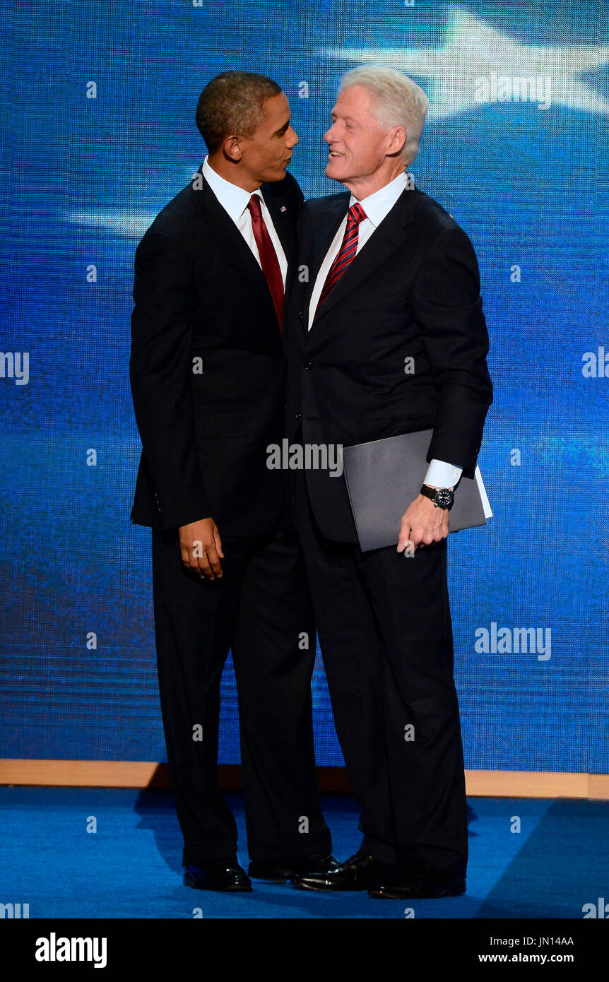 Former United States President Bill Clinton hugs U.S. President Barack ...