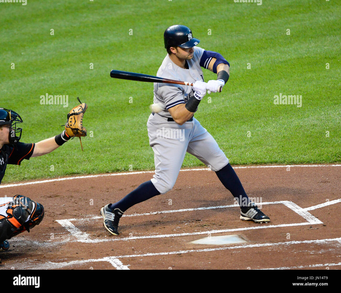 New York Yankees right fielder Nick Swisher (33) takes a ball as he ...