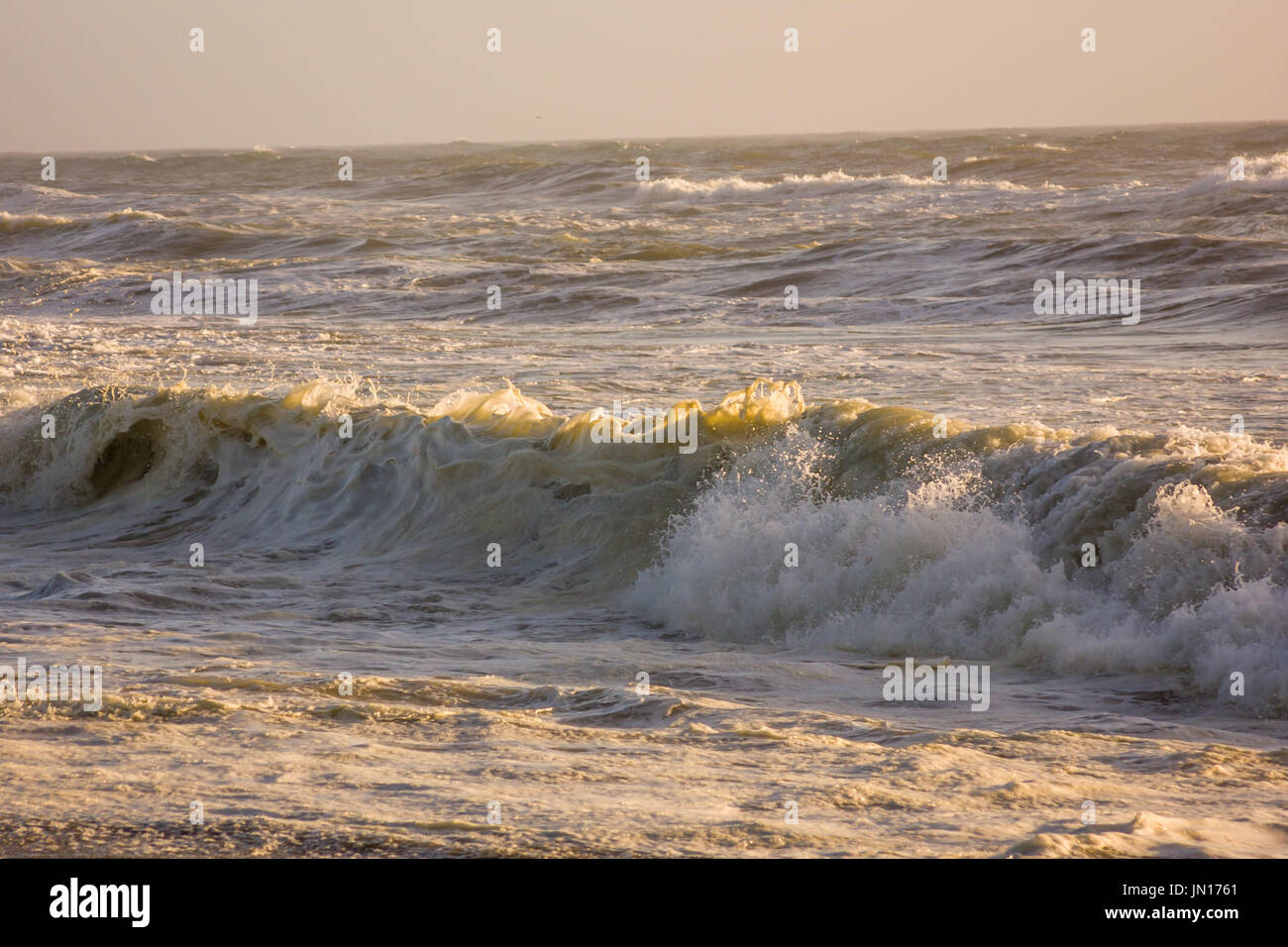water waves and splash sunset Stock Photo - Alamy