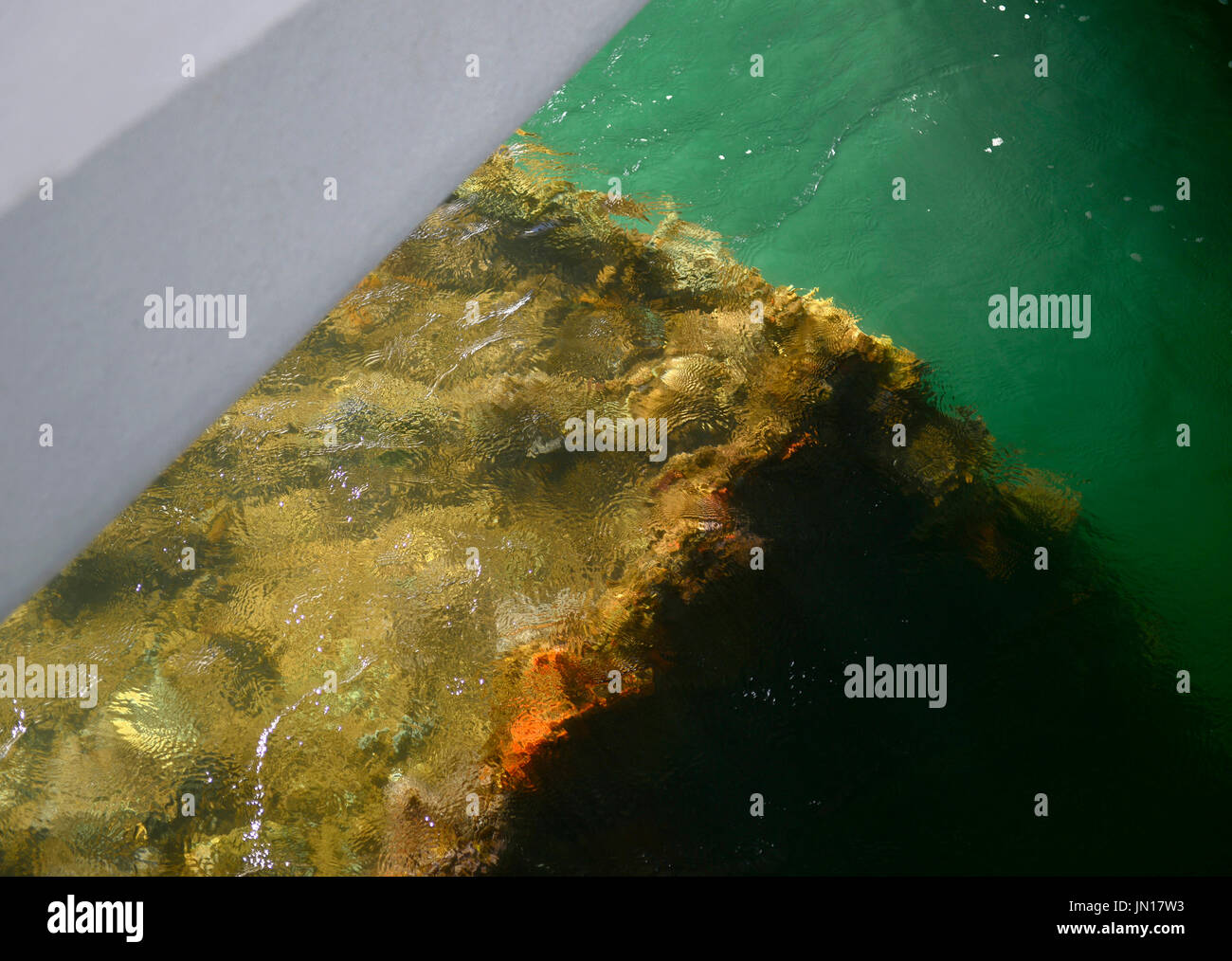 Part of the side of the sunken USS Arizona visible through the Viewing ...