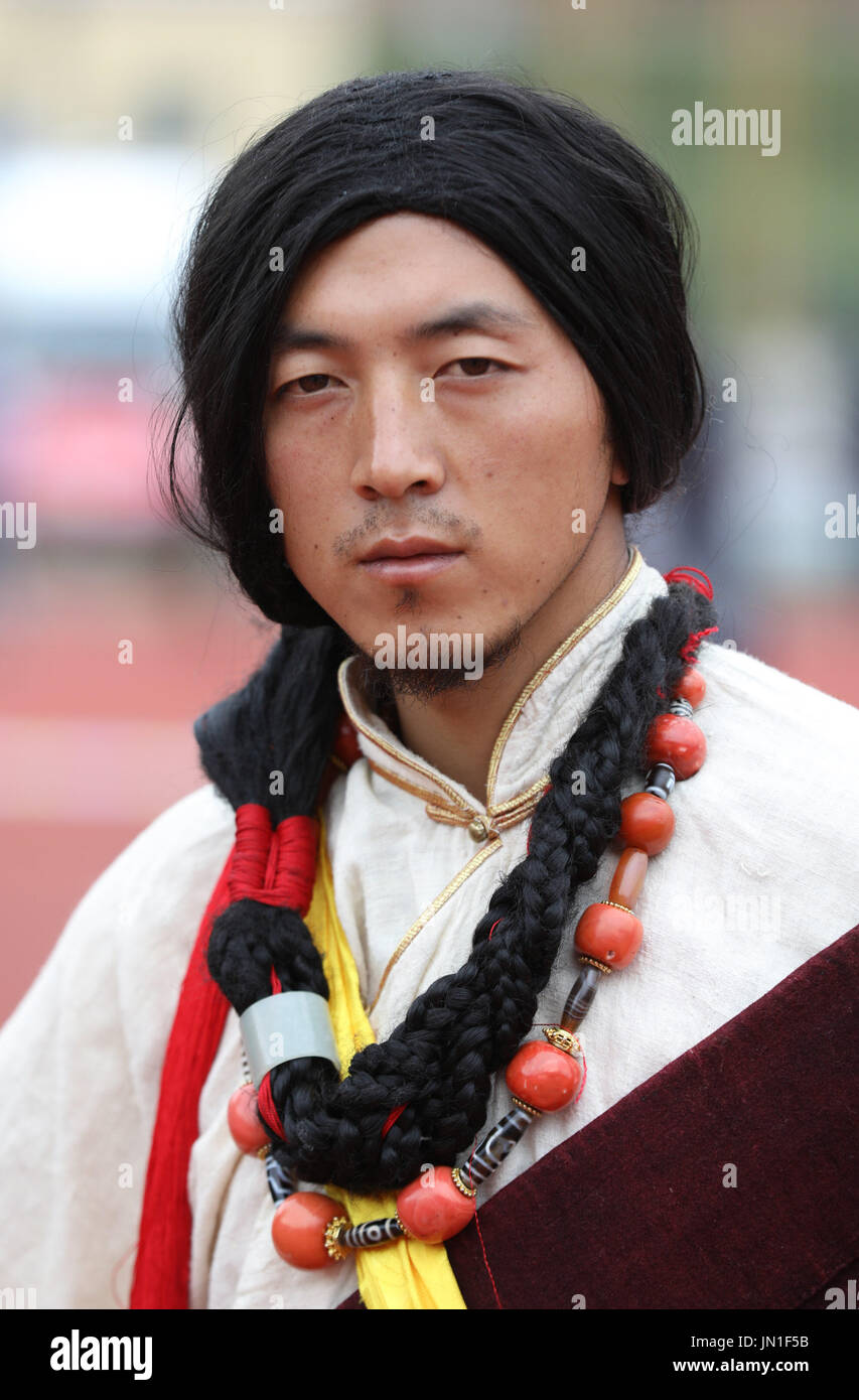 Daofu, China's Sichuan Province. 29th July, 2017. Brightly costumed man ...