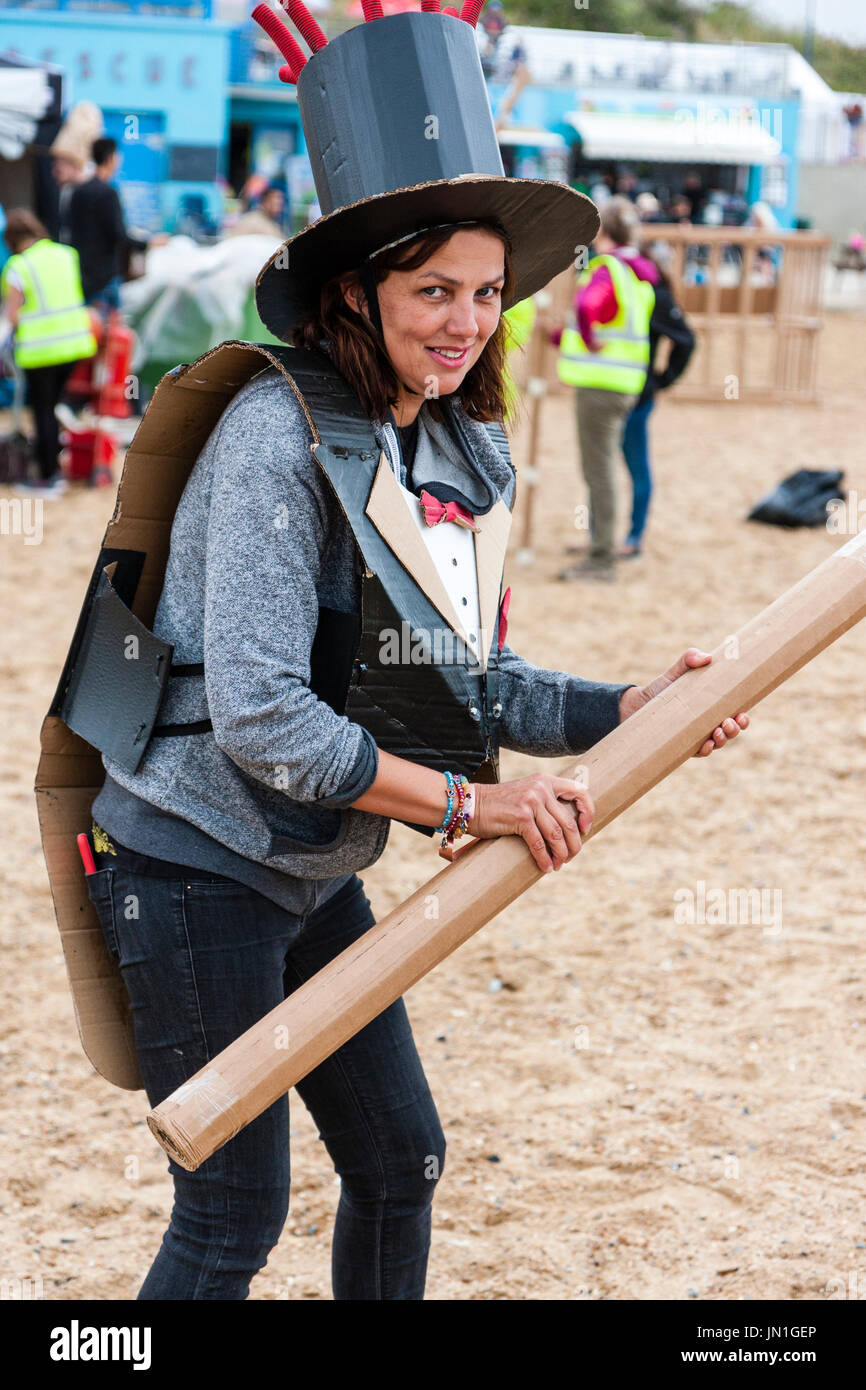 Cardboardia event on Ramsgate beach. Woman, 30s, in black stove hat ...