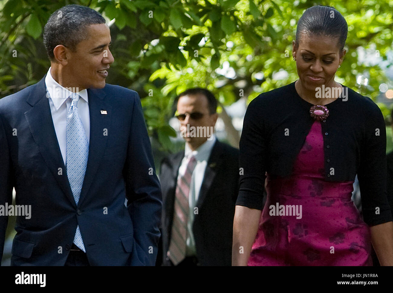 United States President Barack Obama and First Lady Michelle Obama walk ...
