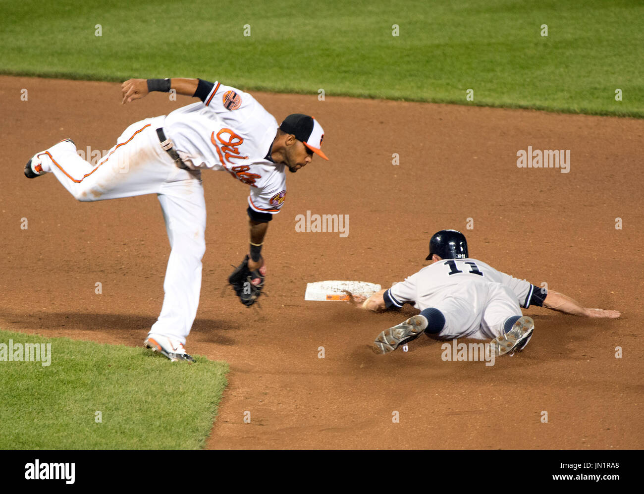New York Yankees left fielder Brett Gardner (11) steals second base in ...