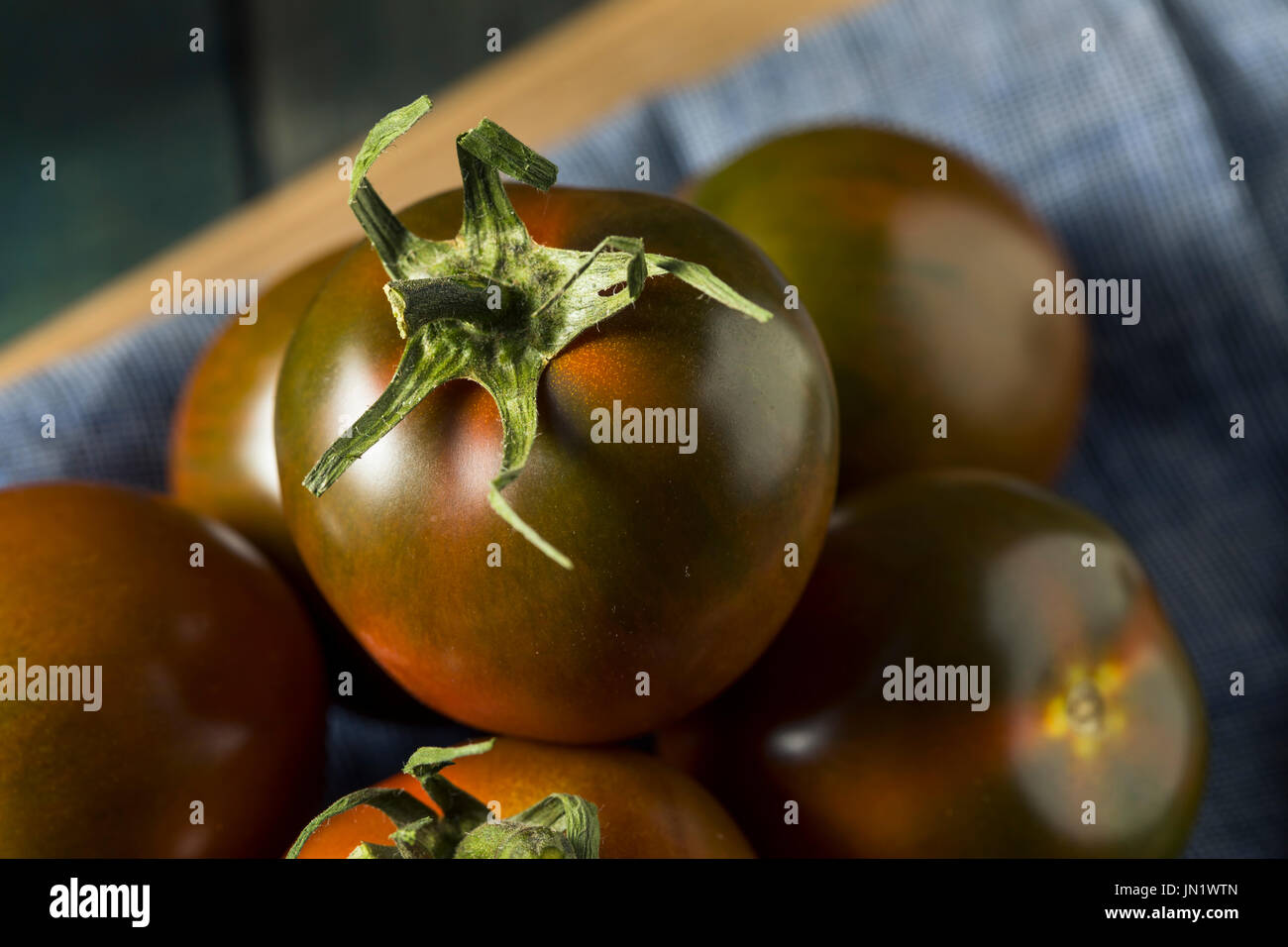 Raw Organic Brown Kumato Tomatoes Ready to Eat Stock Photo - Alamy