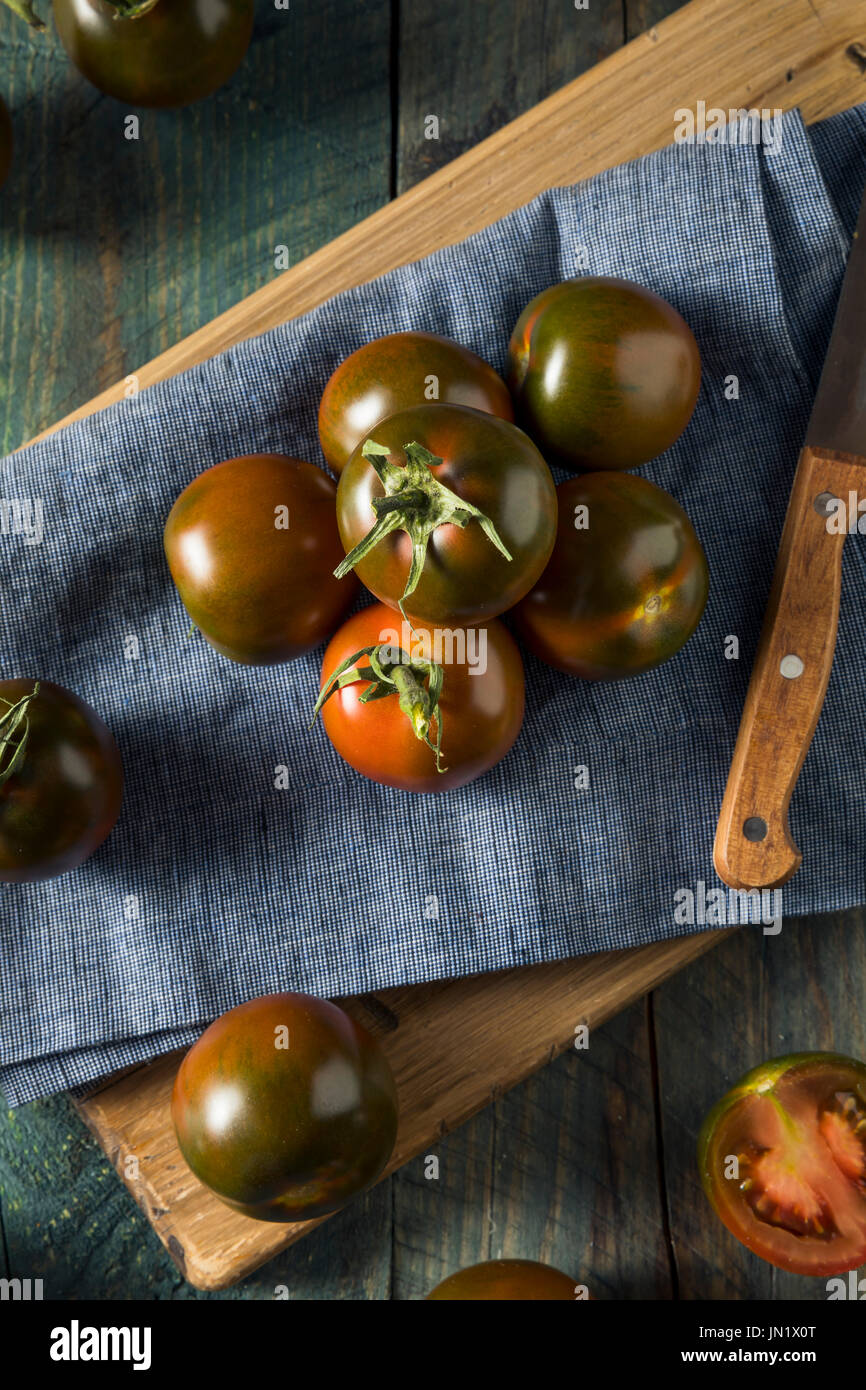Kumato black cherry tomato hi-res stock photography and images - Alamy