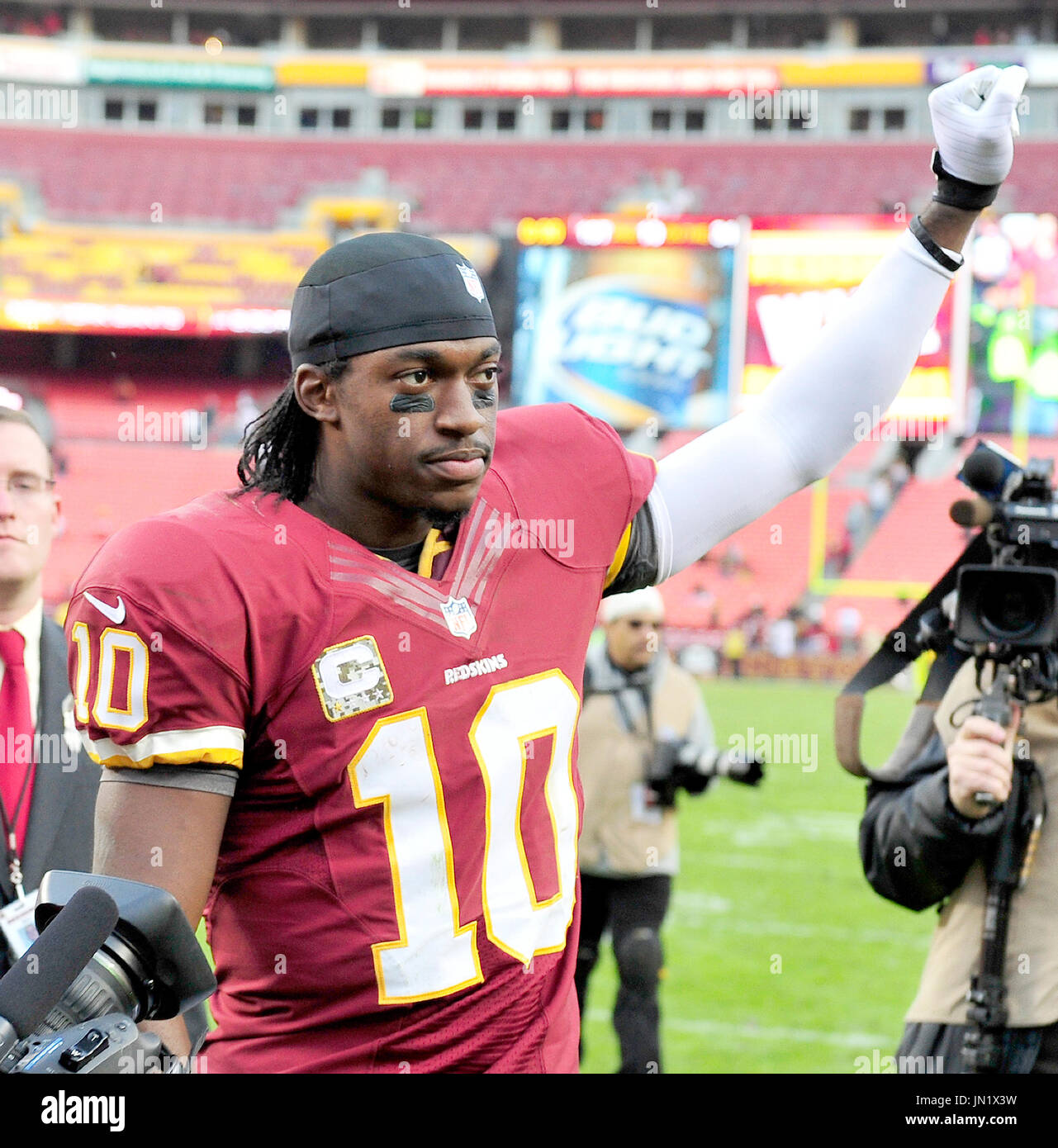 Washington Redskins quarterback Robert Griffin III gestures to the fans ...