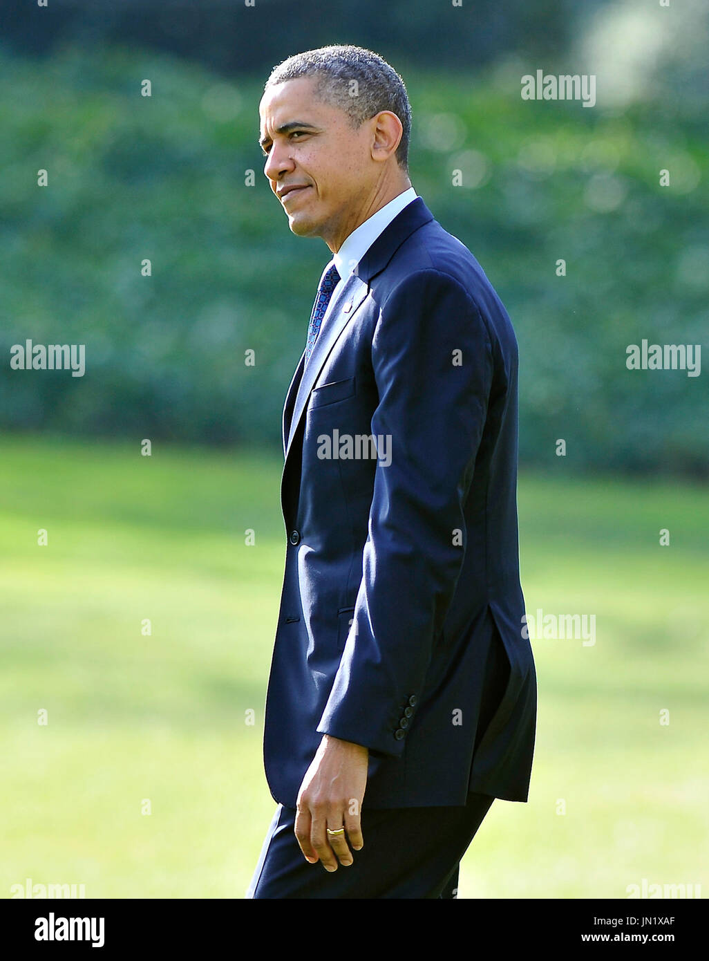 United States President Barack Obama walks across the South Lawn of the ...