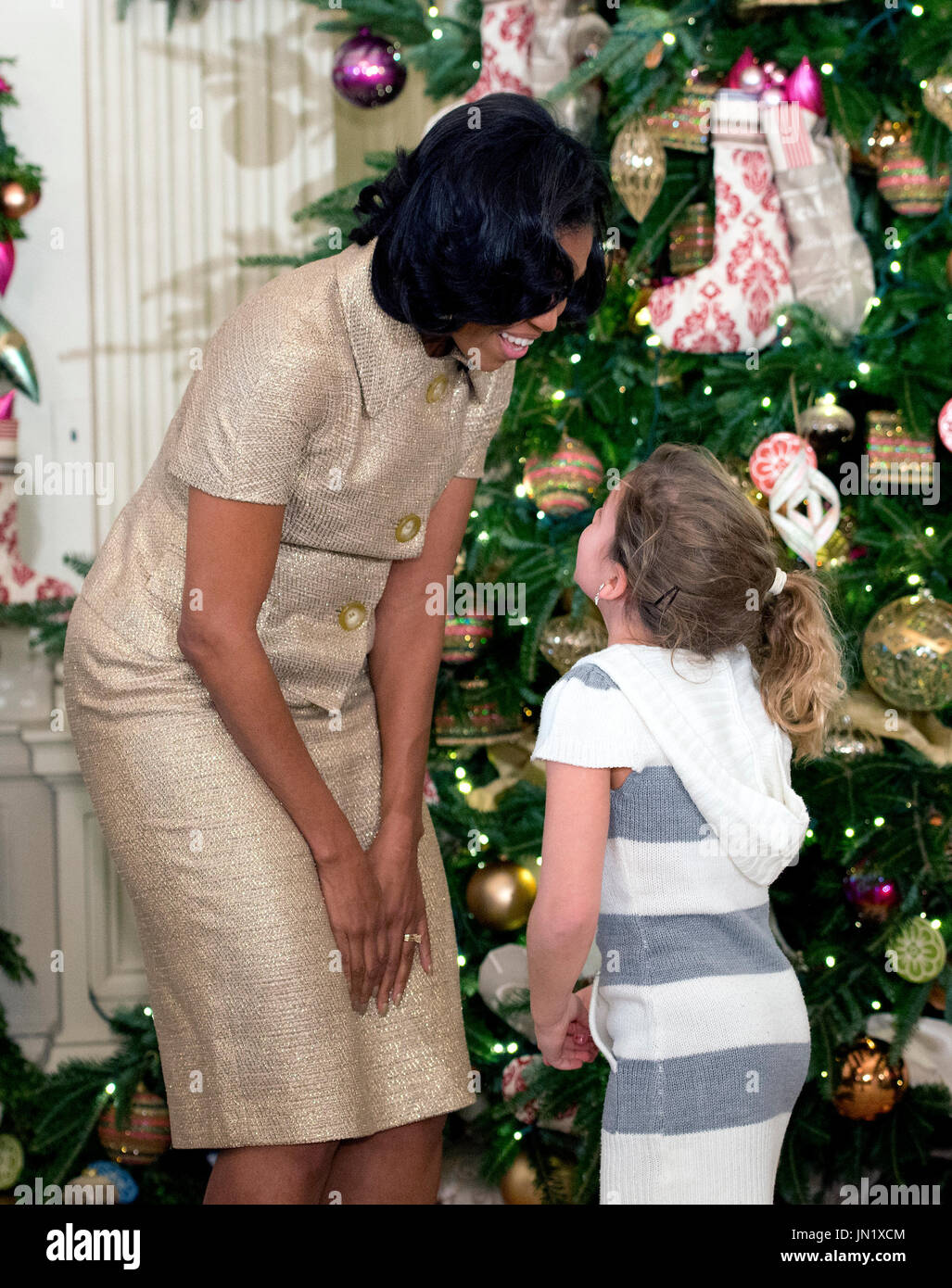 First lady Michelle Obama listens to an unidentified girl during the ...