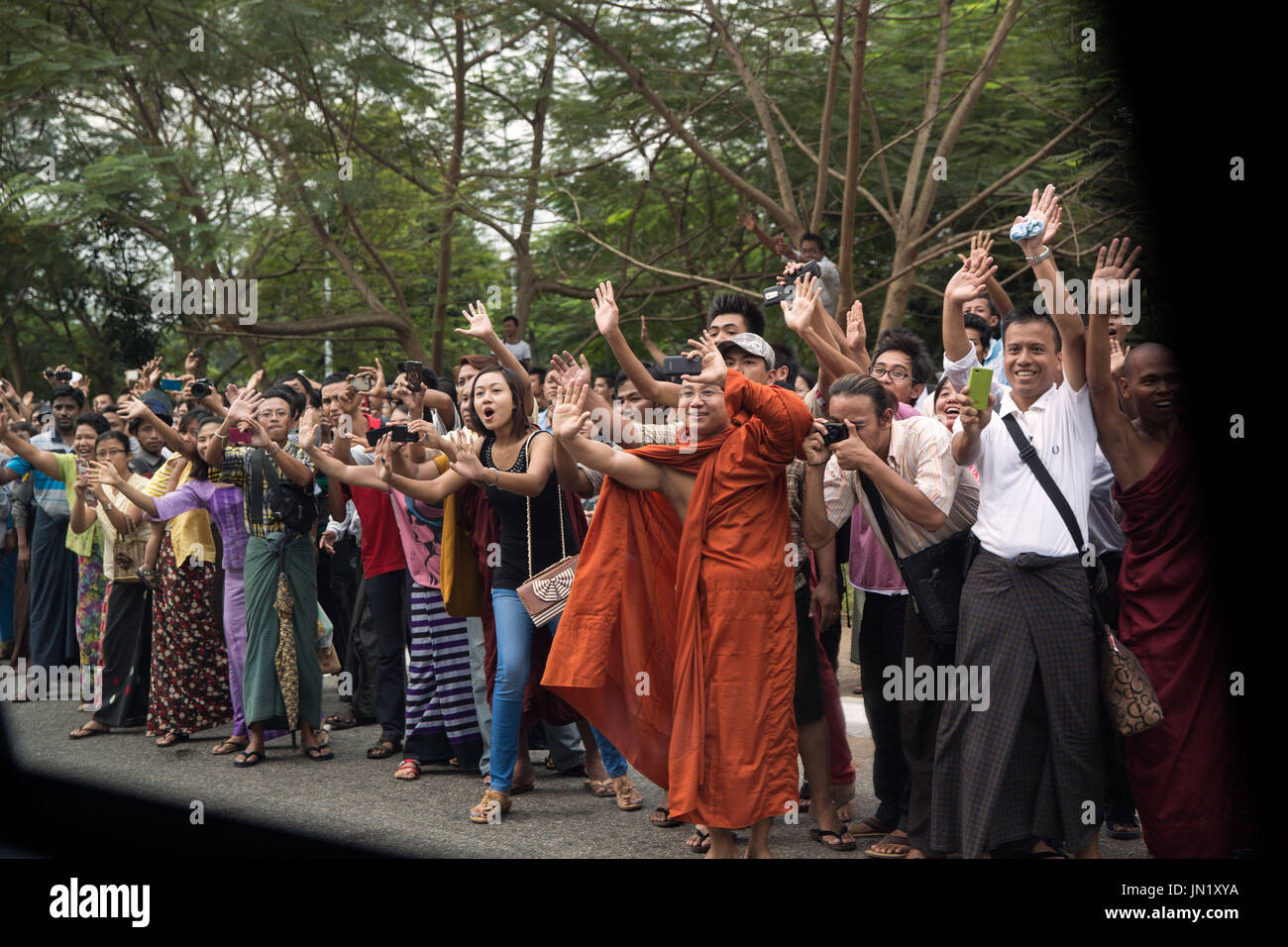 Residents line the motorcade route to welcome United States President ...