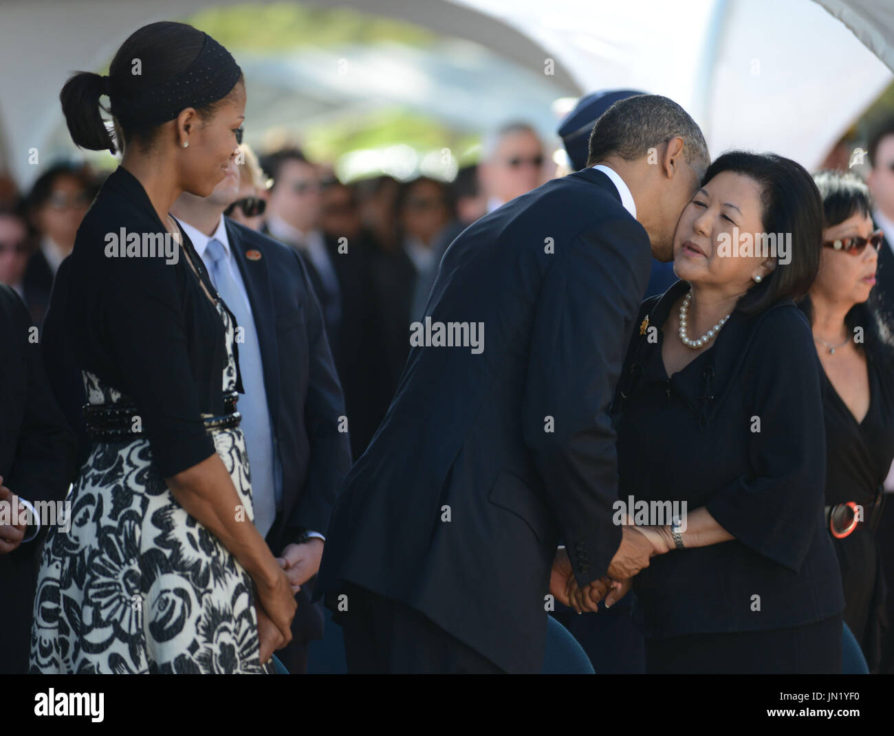 United States President Barack Obama kisses the cheek of Irene Hirano ...