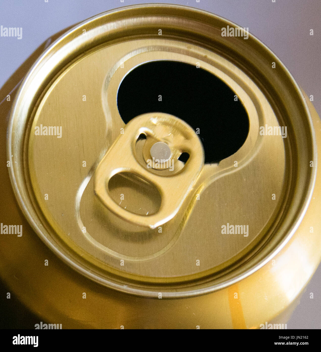 Top view of an opened golden beer can Stock Photo - Alamy