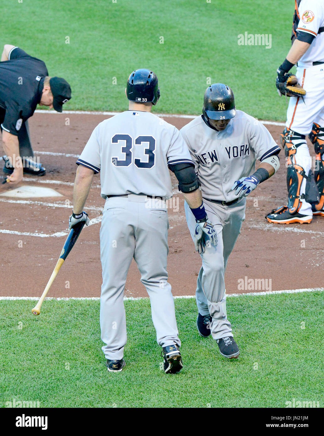 New York Yankees second baseman Robinson Cano (24) is congratulated by ...