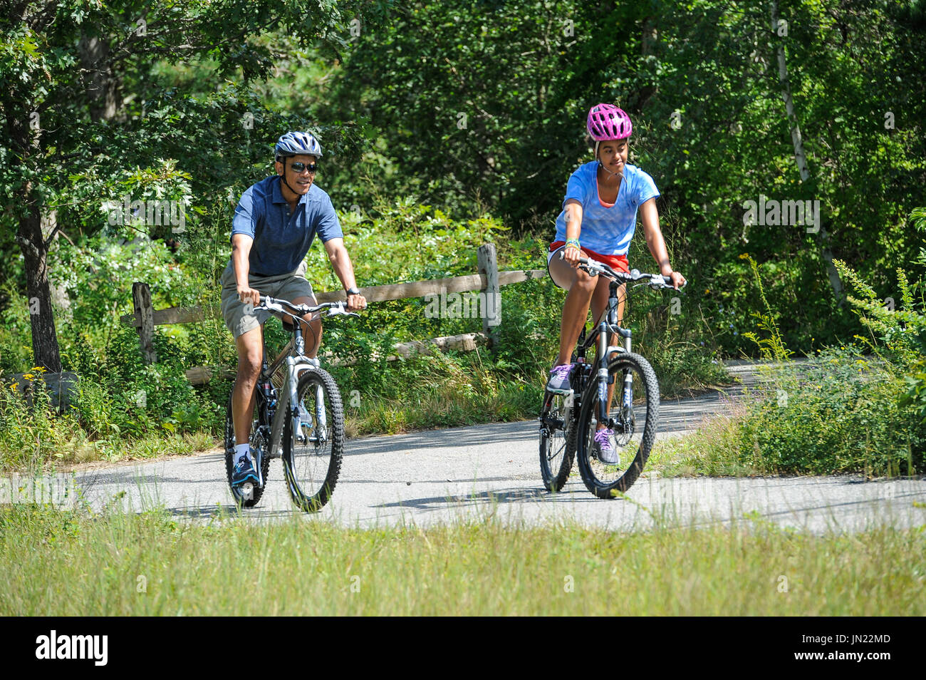 United States President Barack Obama goes bike riding with his daughter ...