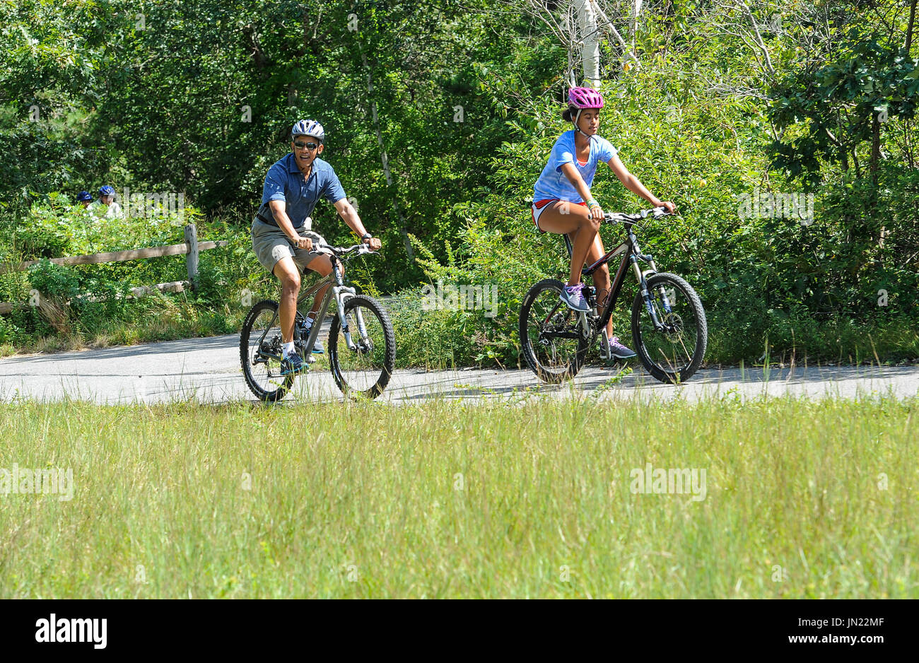 United States President Barack Obama goes bike riding with his daughter ...
