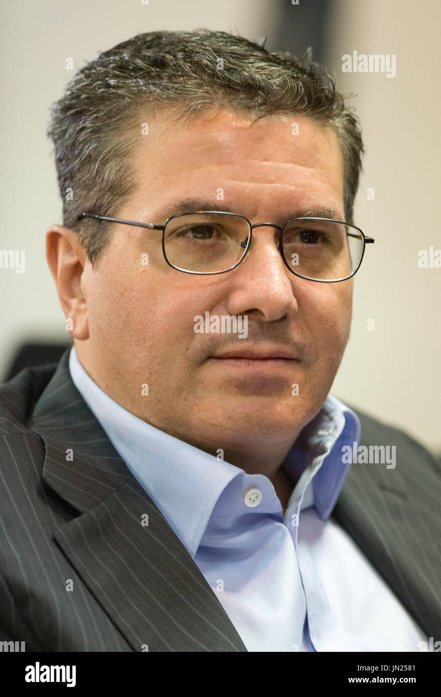 Daniel M. Snyder, owner of the Washington Redskins listens as Jay ...