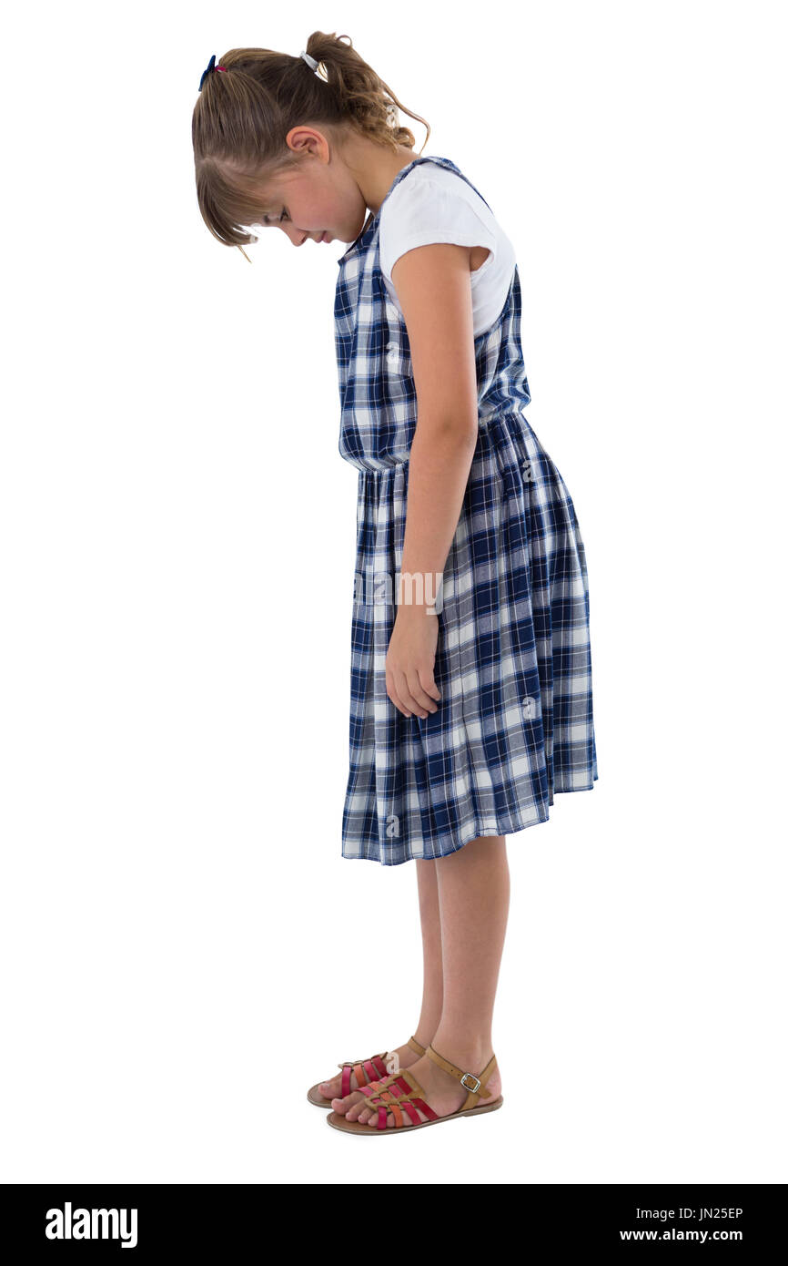 Cute girl standing on white background Stock Photo - Alamy