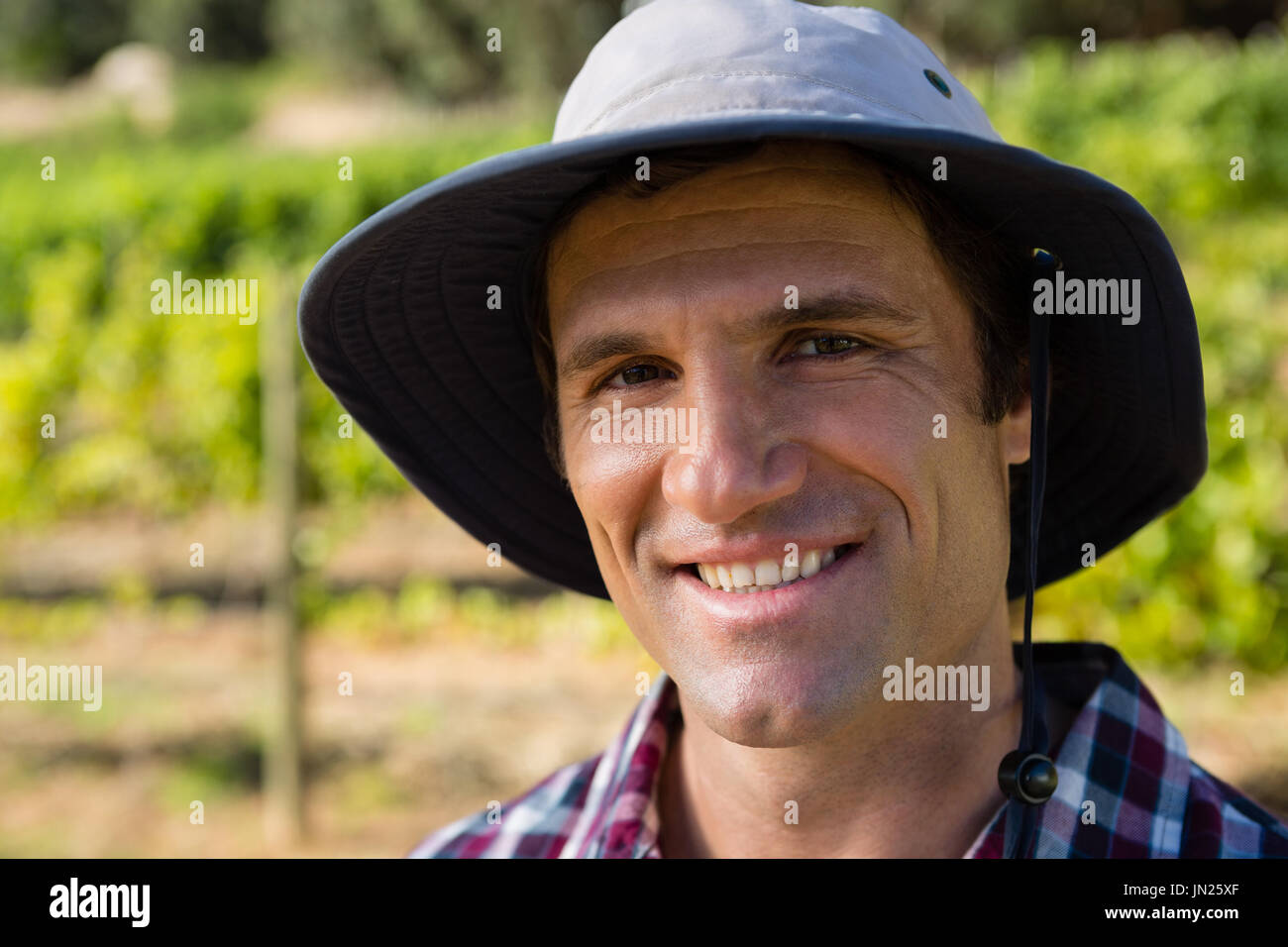Handsome male farmer in hat hi-res stock photography and images - Alamy