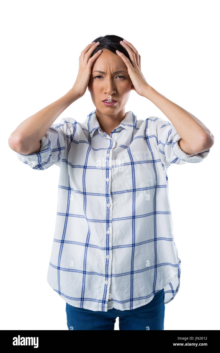 Portrait of worried woman standing against white background Stock Photo ...