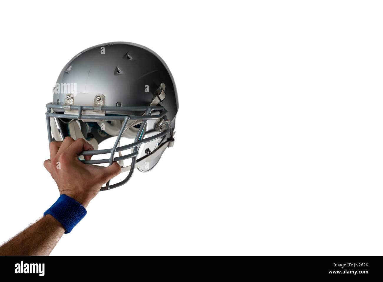 Cropped image of hand holding helmet against white background Stock ...