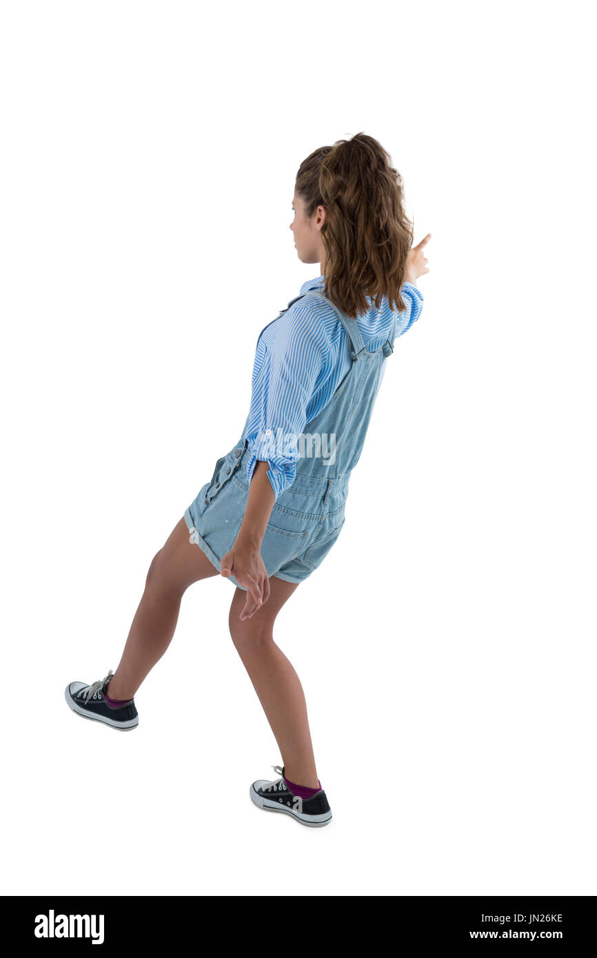 Side view of teenage girl posing on white background Stock Photo - Alamy