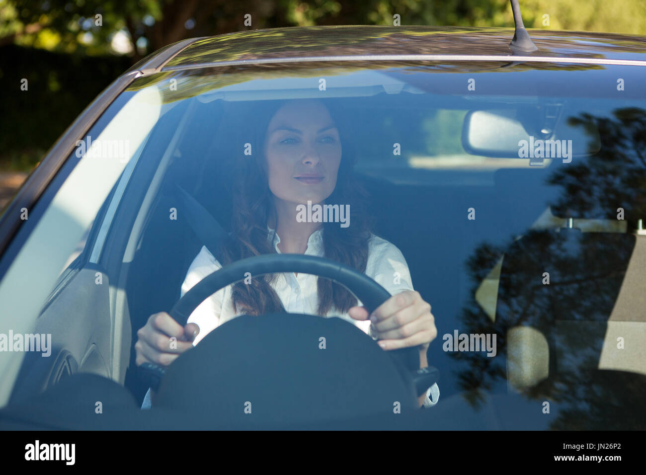 Beautiful woman driving a car Stock Photo - Alamy