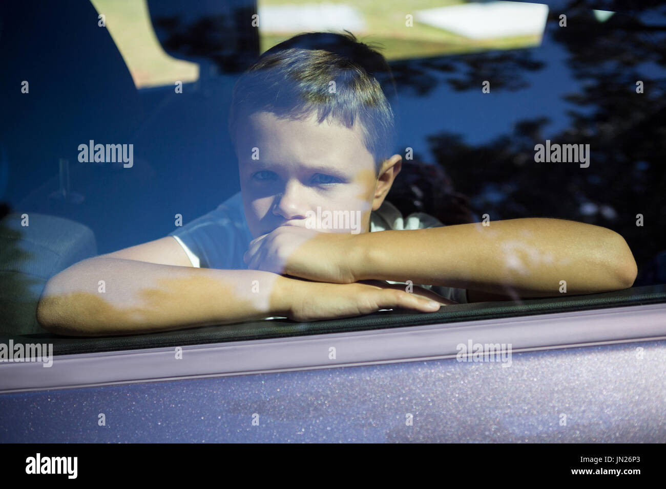 Portrait of teenage boy sitting inside a car Stock Photo - Alamy