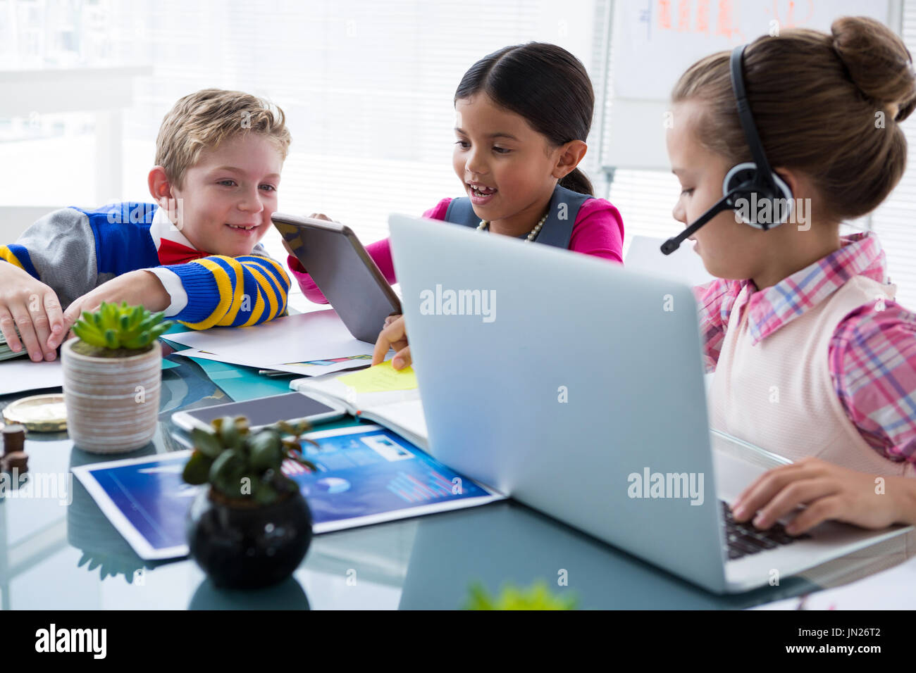 Kids business executives working together hi-res stock photography and ...