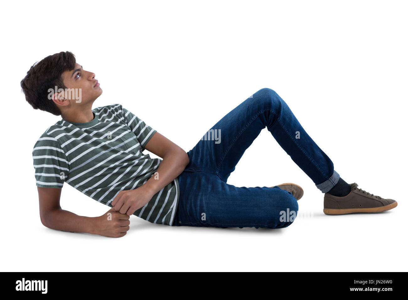 Thoughtful teenage boy relaxing on white background Stock Photo - Alamy