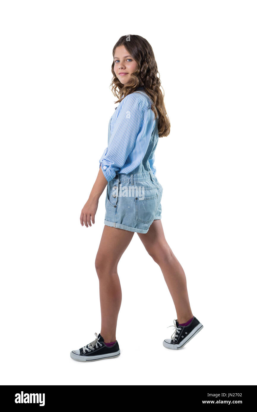 Portrait of teenage girl standing on white background Stock Photo - Alamy