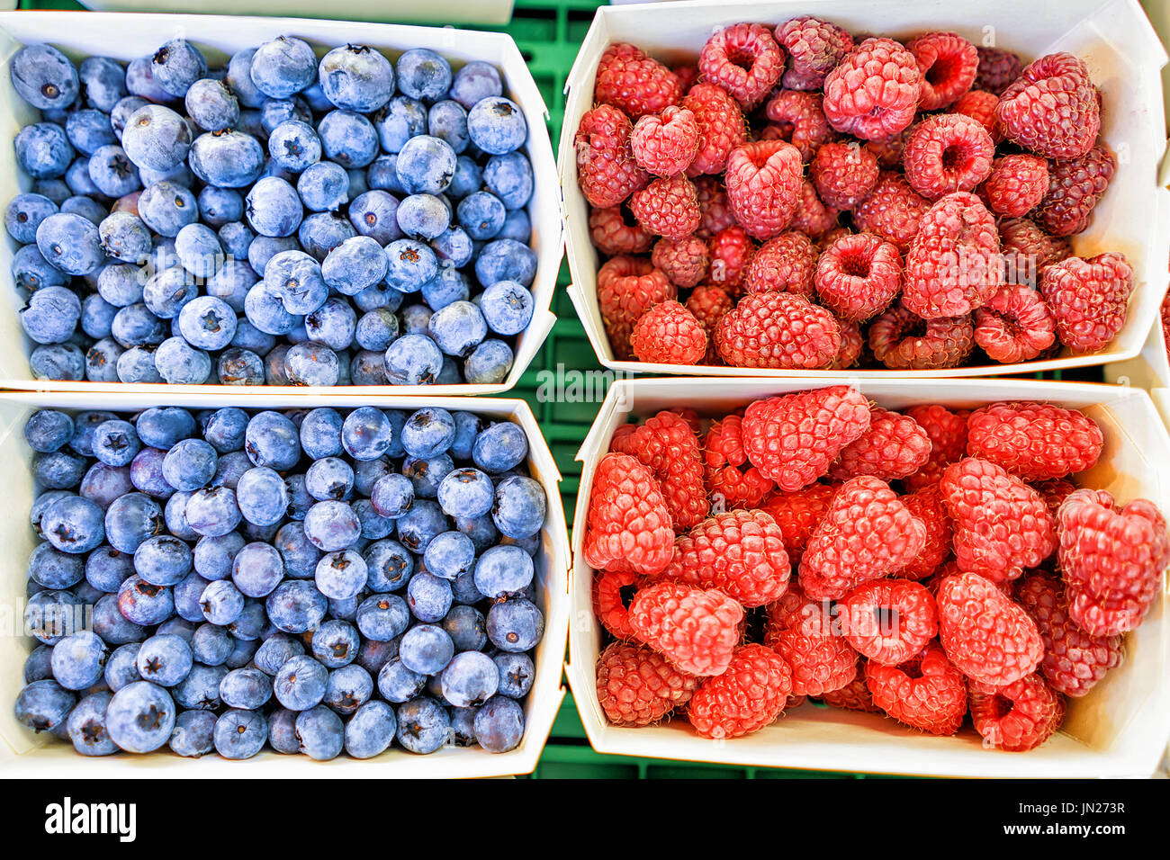 Closeup of fresh raspberry and blueberry in boxes Stock Photo - Alamy
