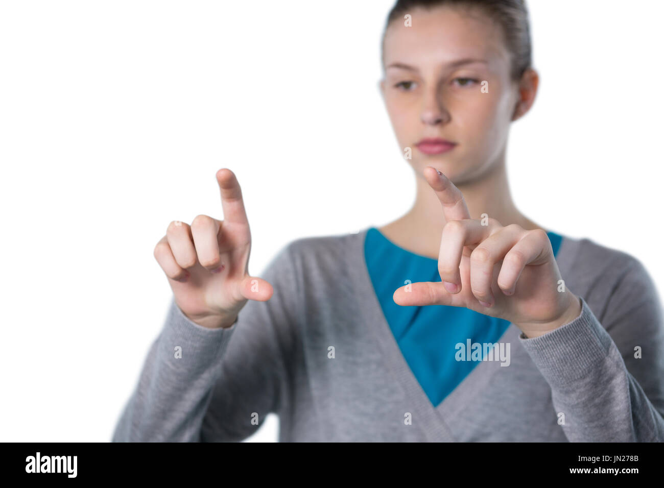 Teenage girl forming a finger frame against white background Stock ...