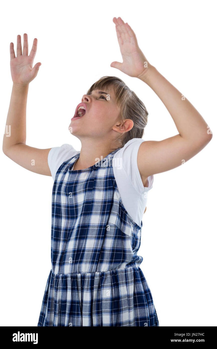 Cute girl shouting against white background Stock Photo - Alamy