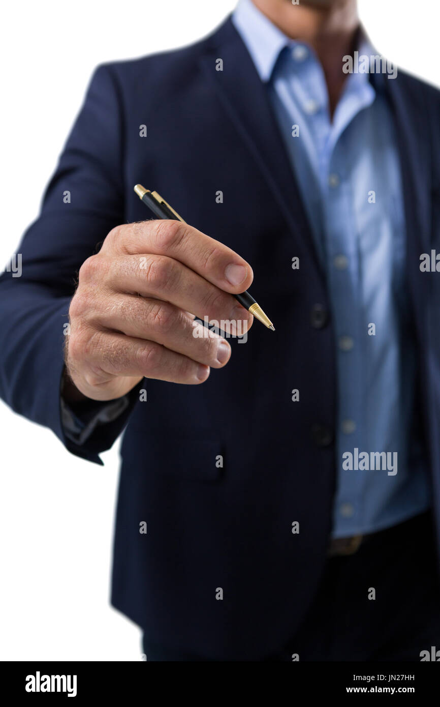 Mid section of businessman pretending to write on invisible screen ...
