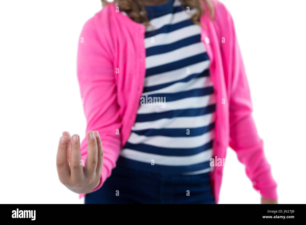 Girl pretending to be holding invisible object against white background ...