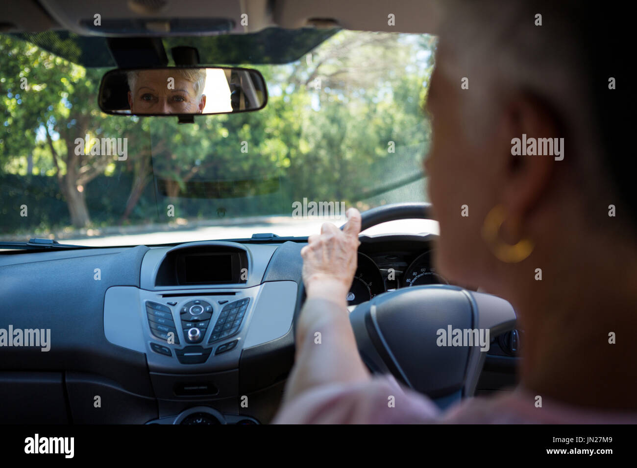 Adjusting the rear view mirror of a car hi-res stock photography and ...