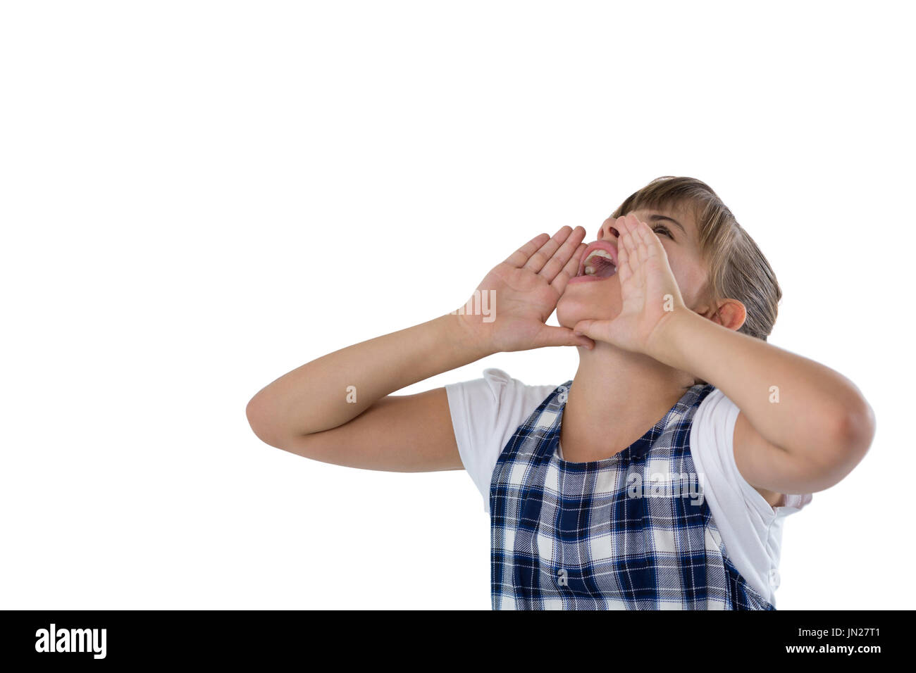 Close-up of girl shouting against white background Stock Photo - Alamy