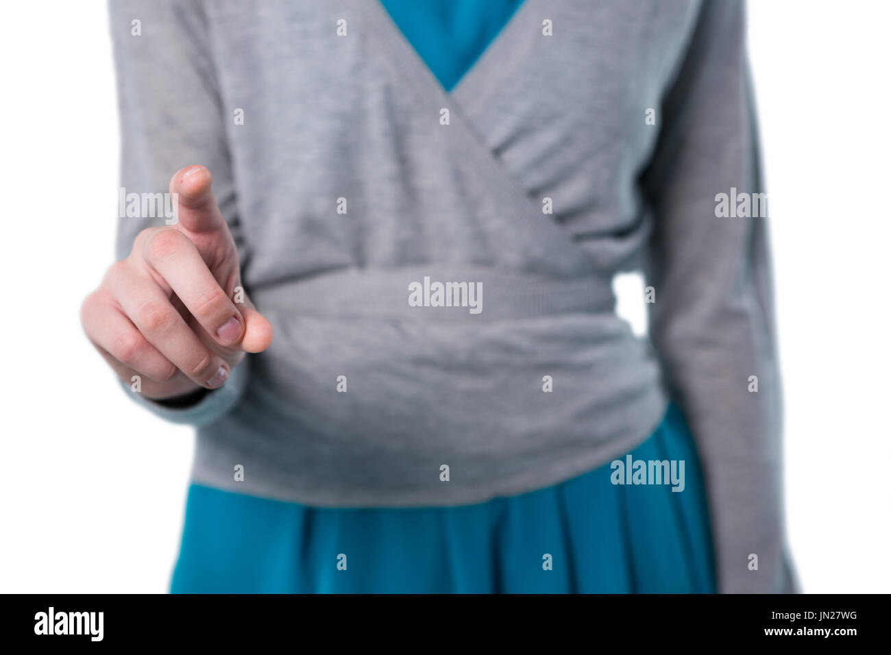 Mid section of teenage girl pressing an invisible virtual screen Stock ...