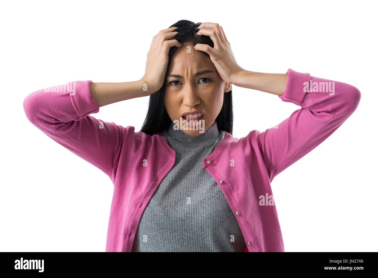 Portrait of depressed woman standing against white background Stock ...