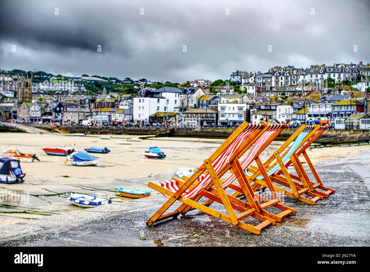 Deck chairs on a stormy summer day, at St Ives, Cornwall Stock Photo ...