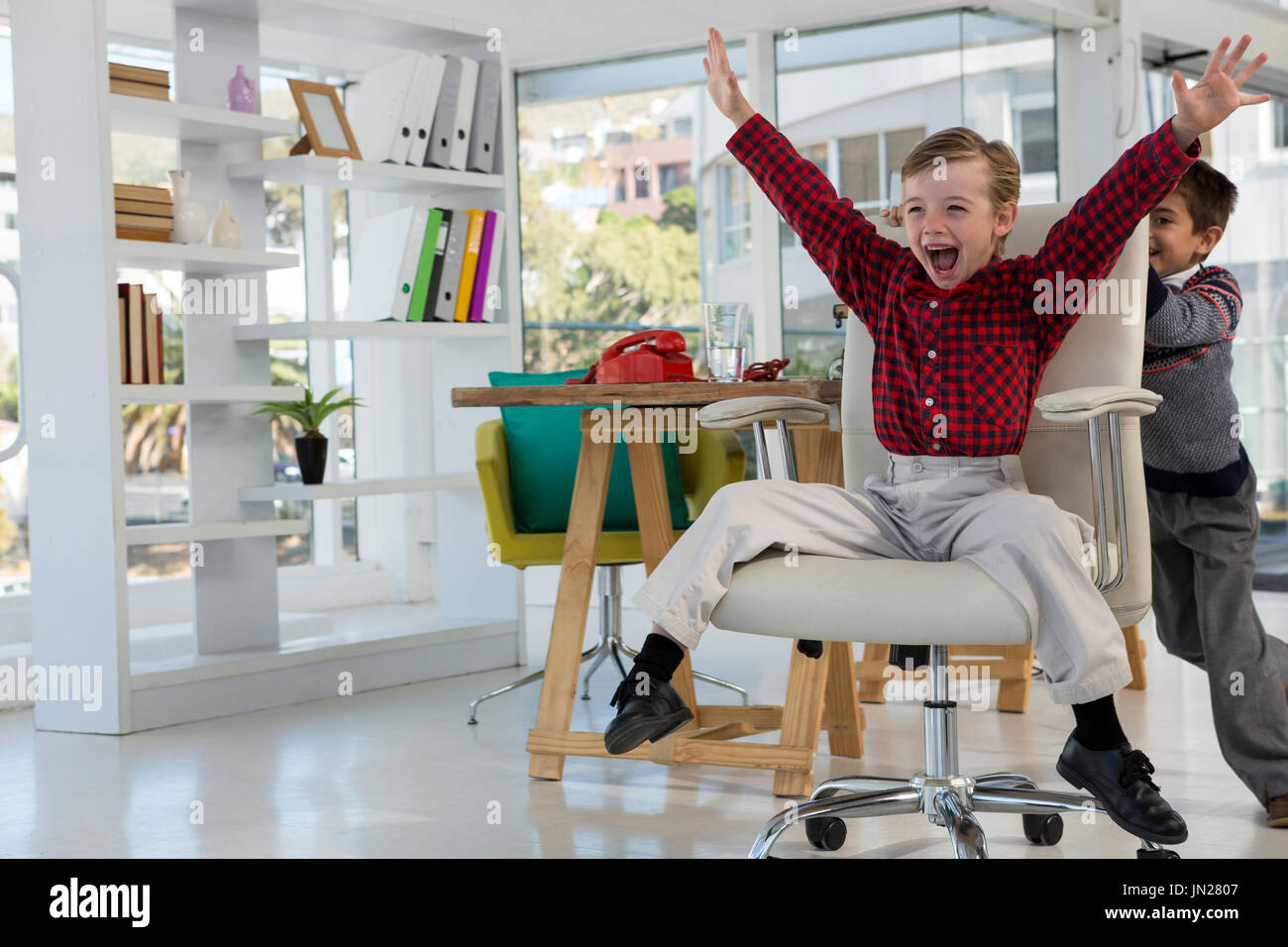 Pushing child in push chair hi-res stock photography and images - Alamy
