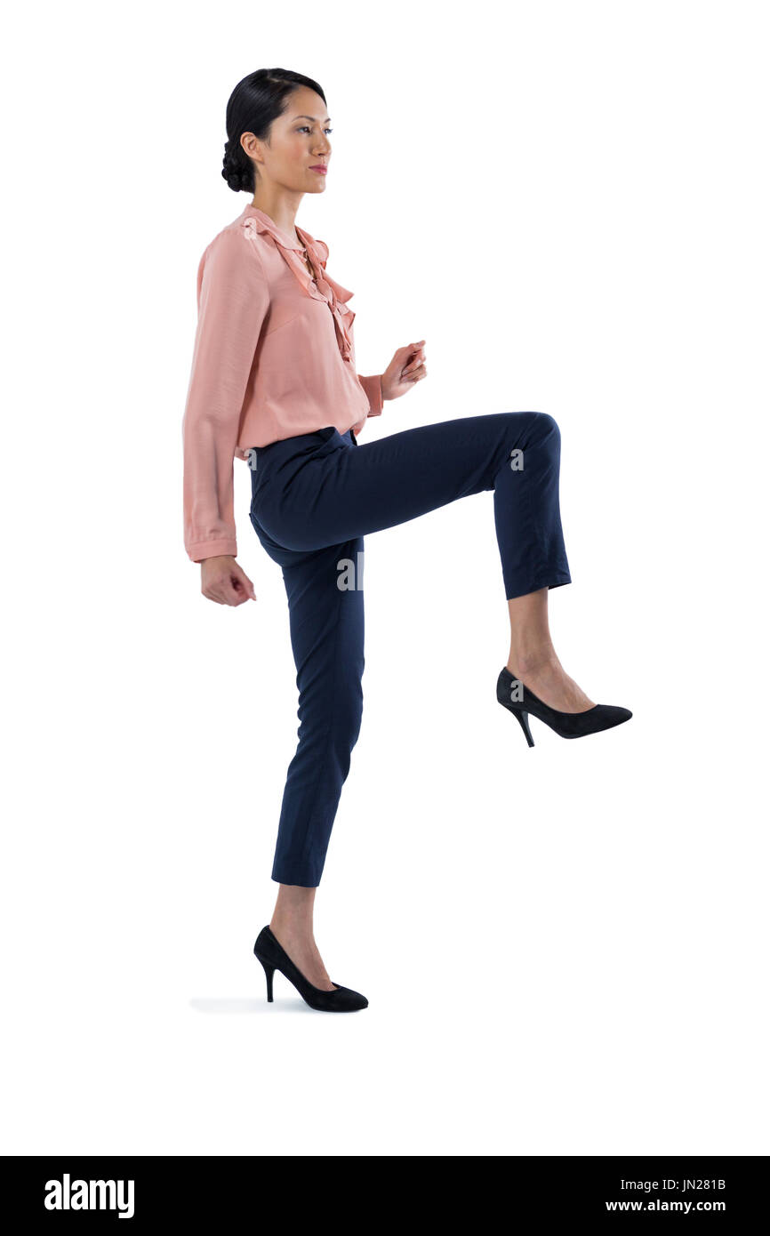 Beautiful female executive posing on white background Stock Photo - Alamy