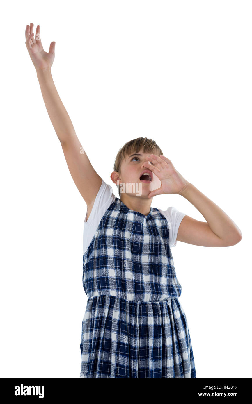 Cute girl shouting against white background Stock Photo - Alamy