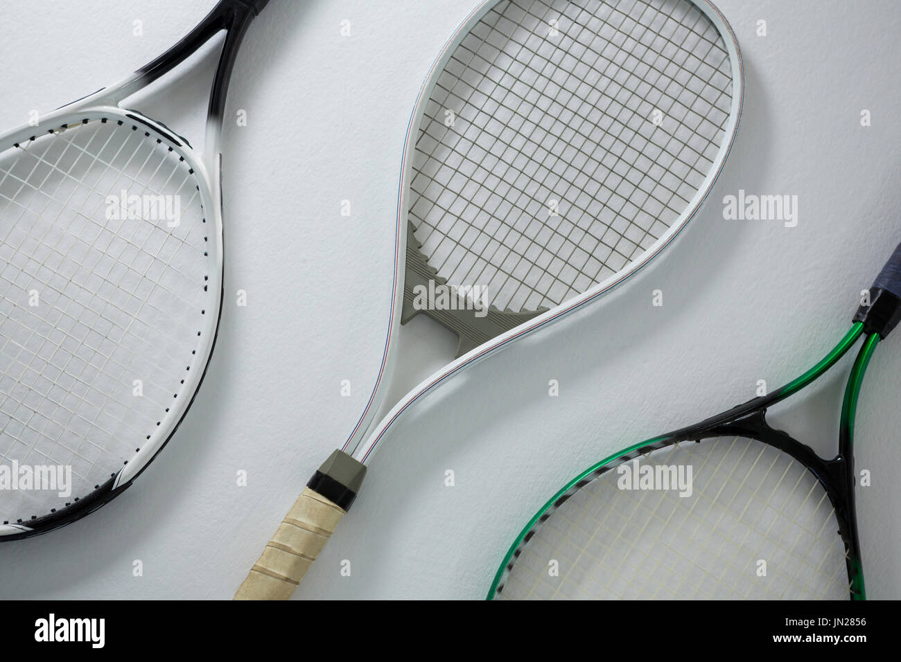 High angle view of metallic tennis rackets on white background Stock ...